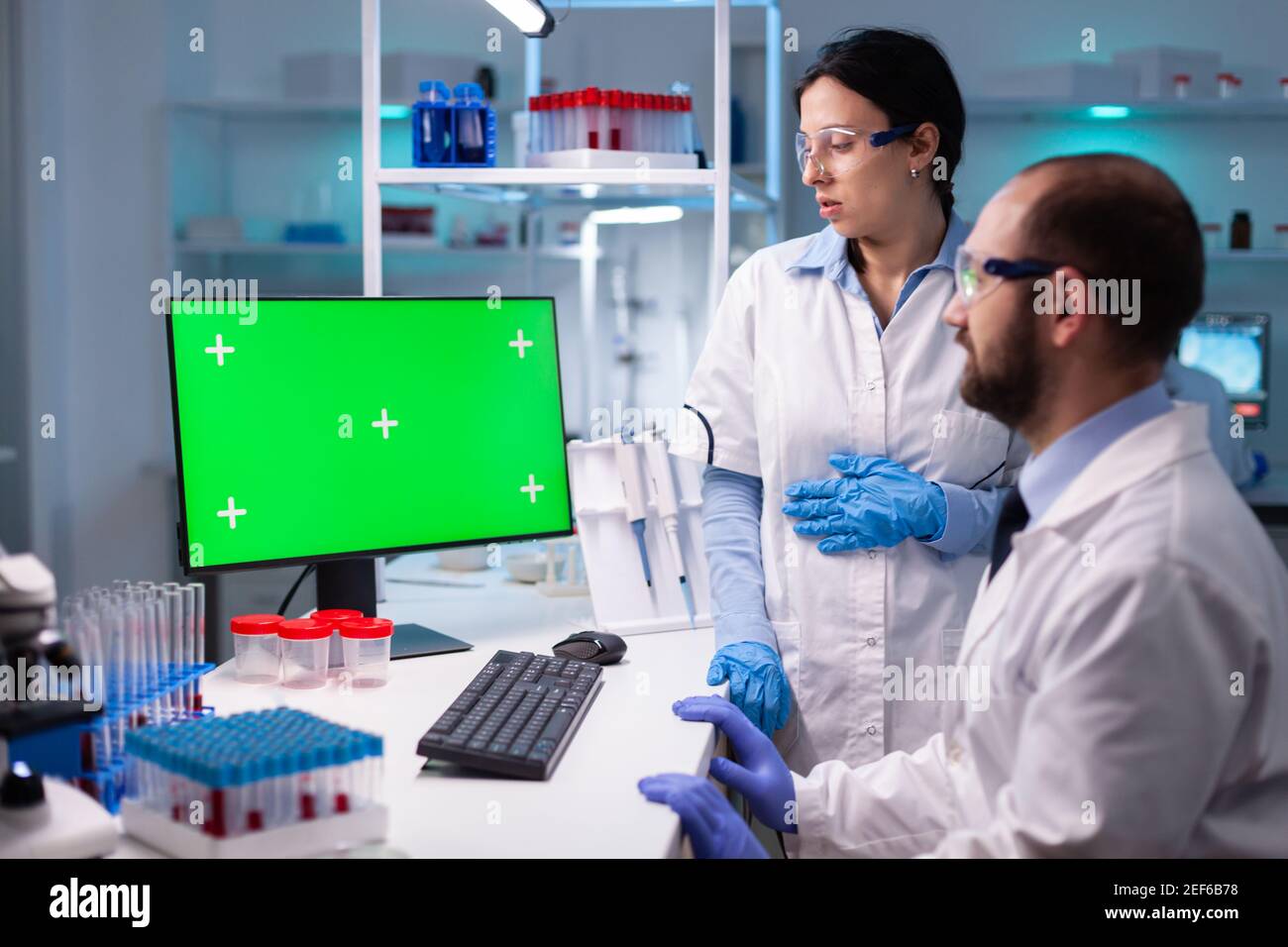 Modern medical research laboratory with two scientists using computer ...