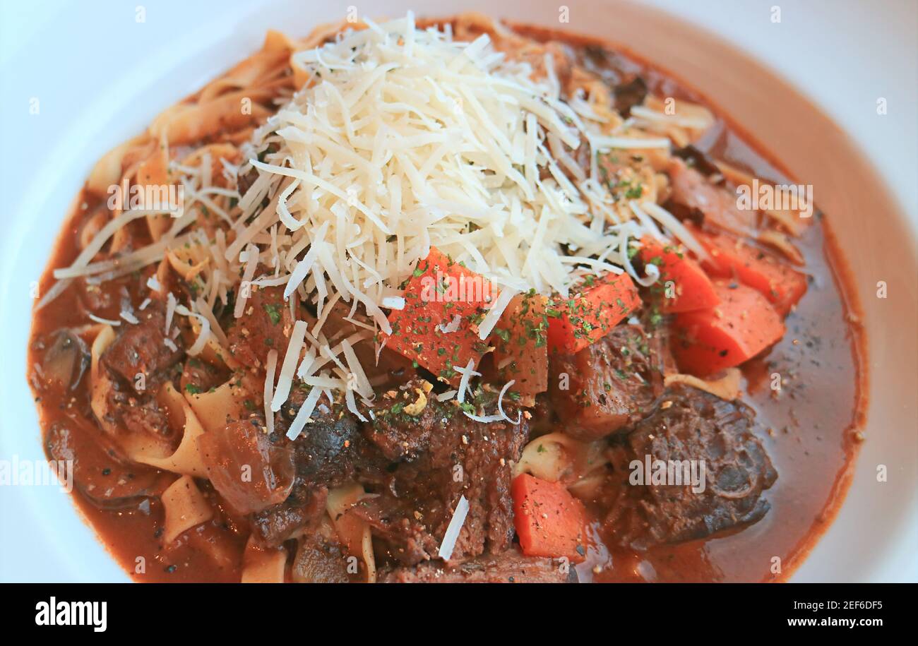 Mouthwatering Beef Stew Fettuccine Topped with Shredded Parmesan Cheese ...