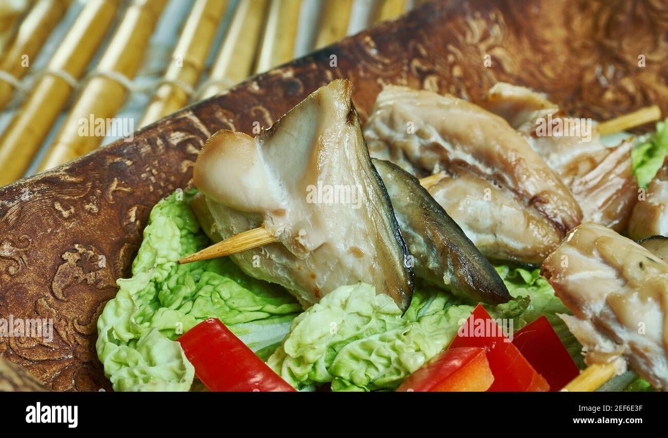 Moroccan Grilled Fish Kebabs, sprinkle seasoning all over skewers Stock ...