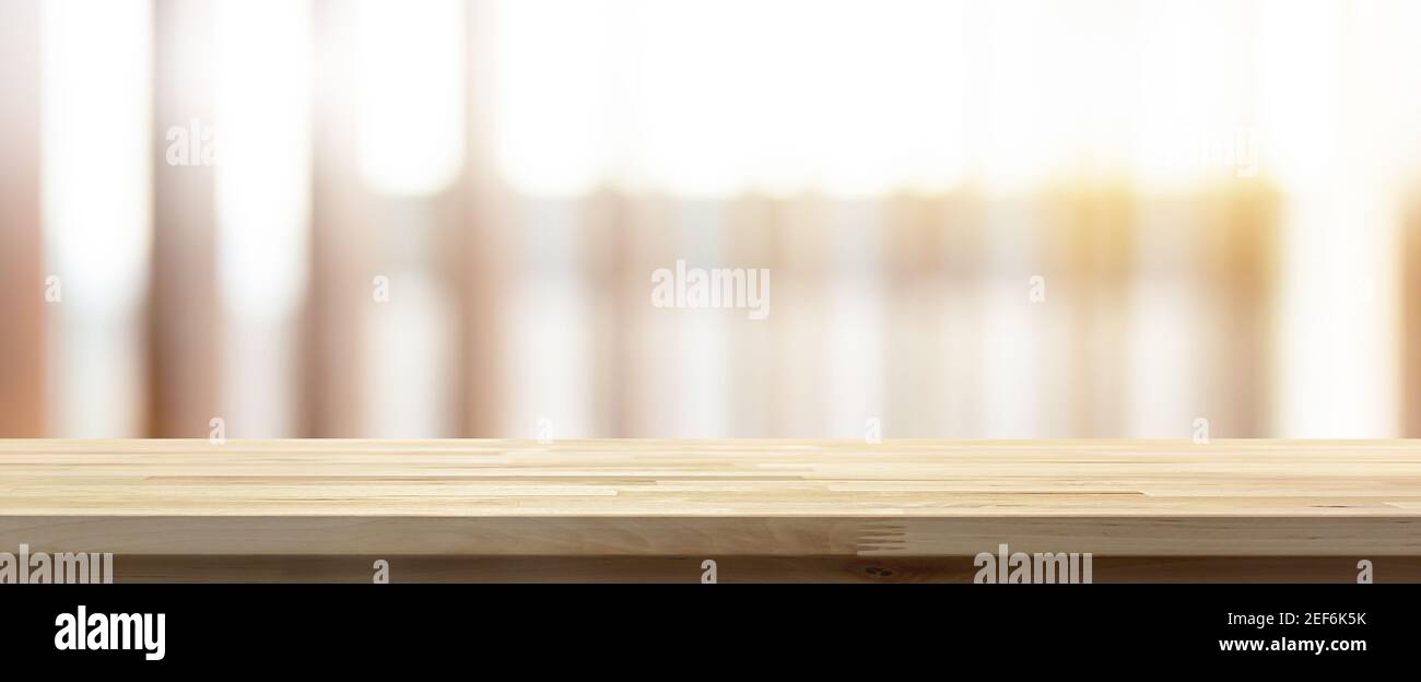 Table top on blur vertical wood slat background with sunlight ...
