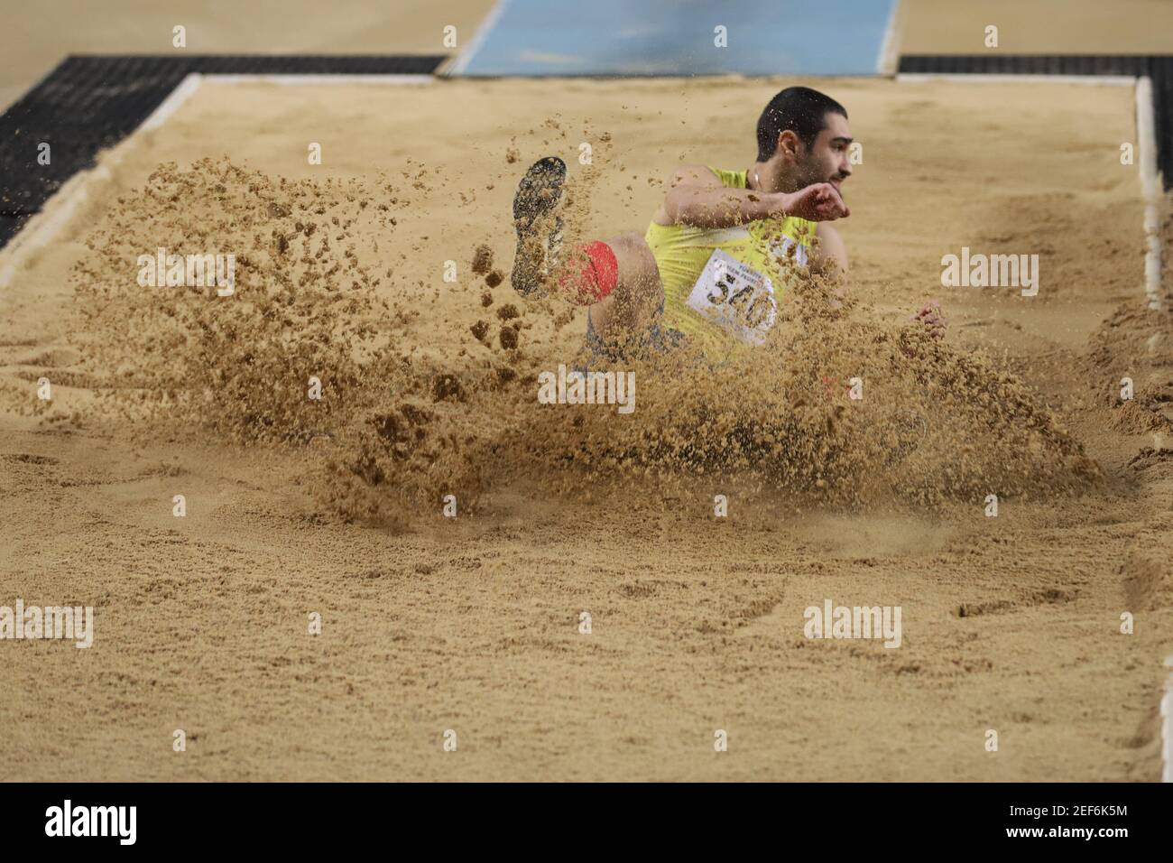 ISTANBUL, TURKEY - FEBRUARY 06, 2021: Undefined athlete long jumping ...
