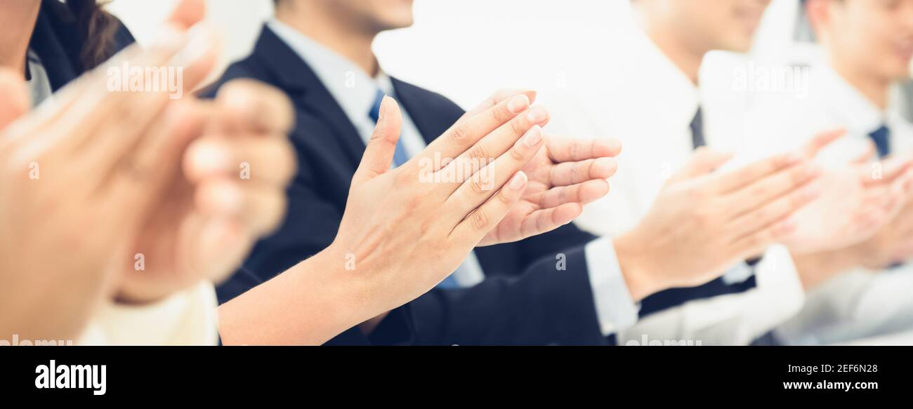 Group of business people clapping their hands at the meeting, panoramic ...