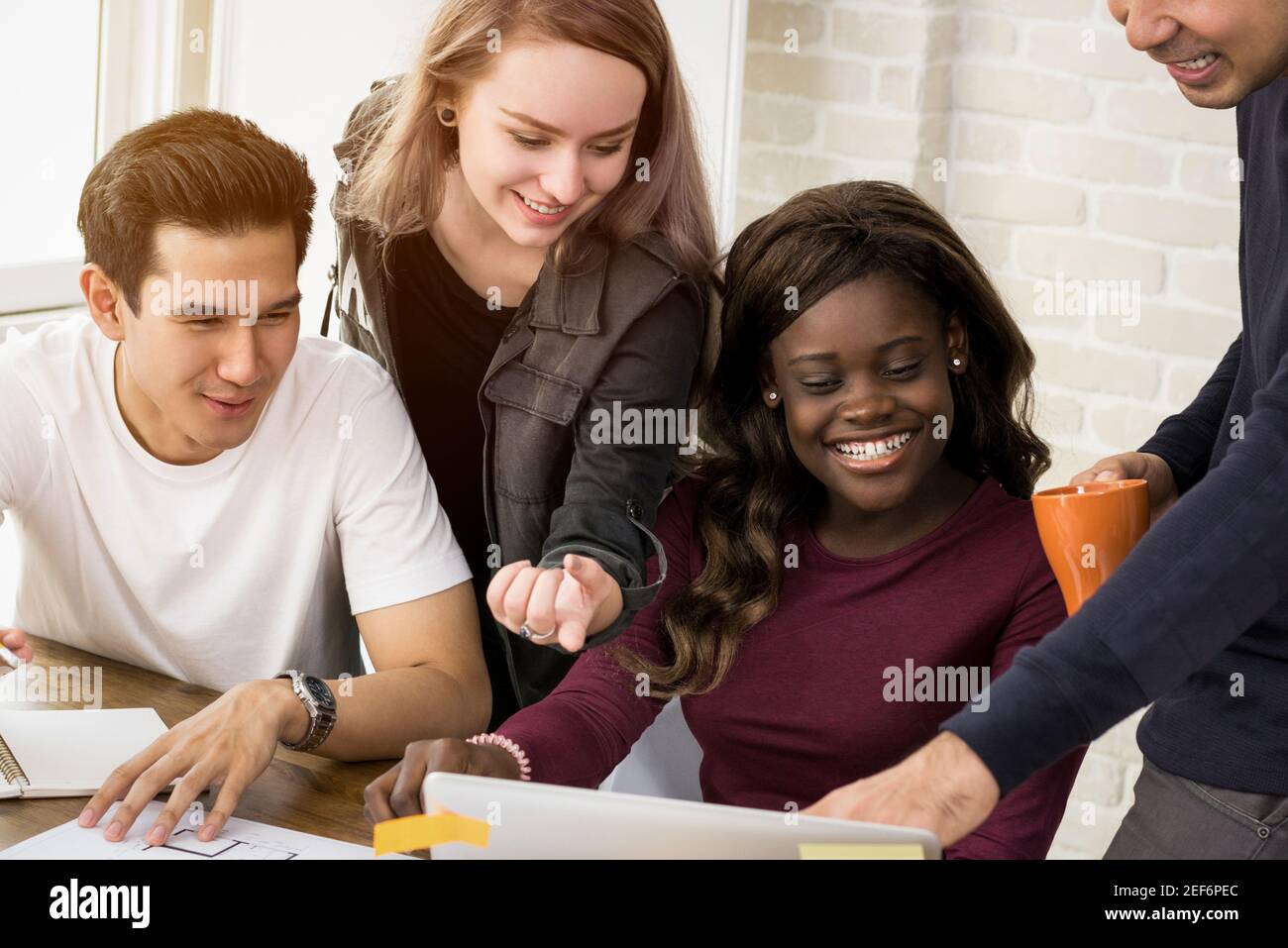 Group of multiethnic university students working together - education ...