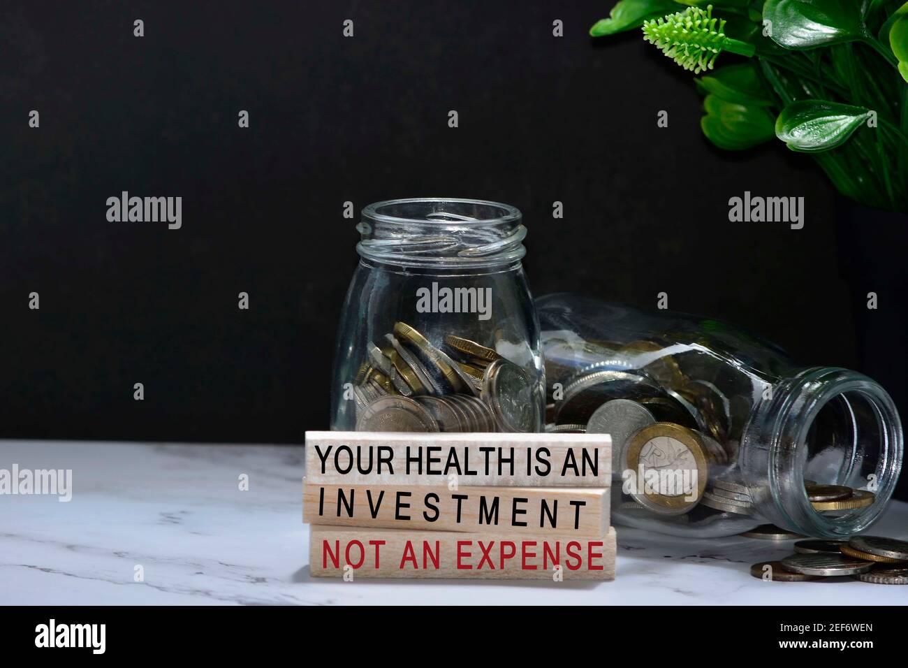 Text on wood block with Australian and European coins on table surface ...
