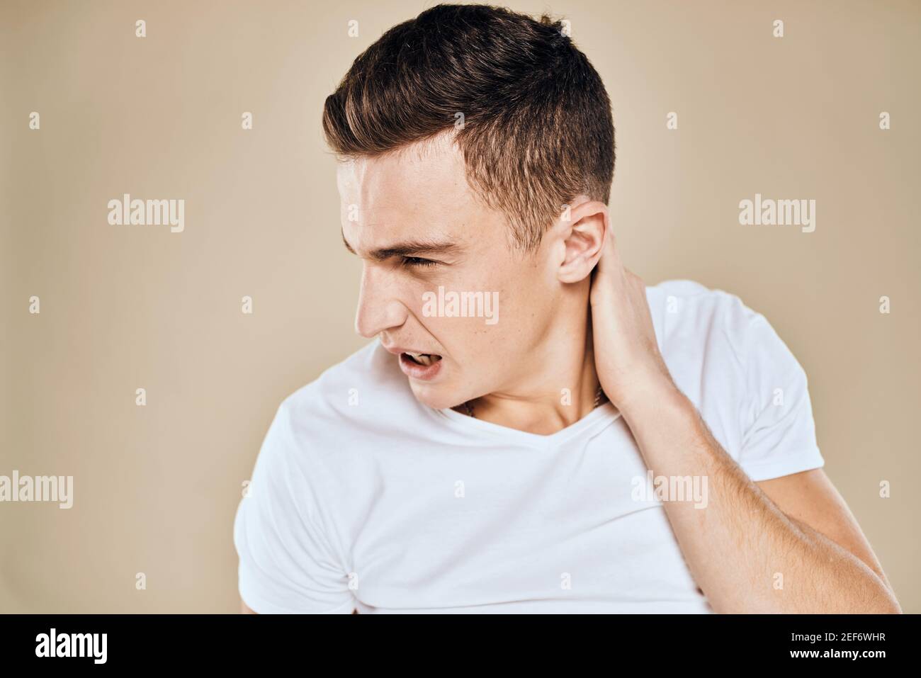 Man with displeased facial expression emotions white t-shirt gestures ...