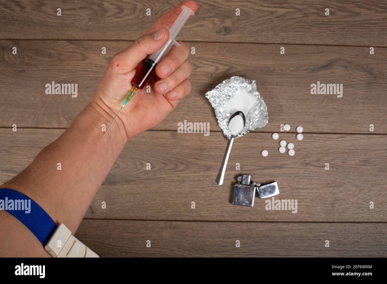 Drug syringes, heroin, spoon on a wooden floor Stock Photo - Alamy
