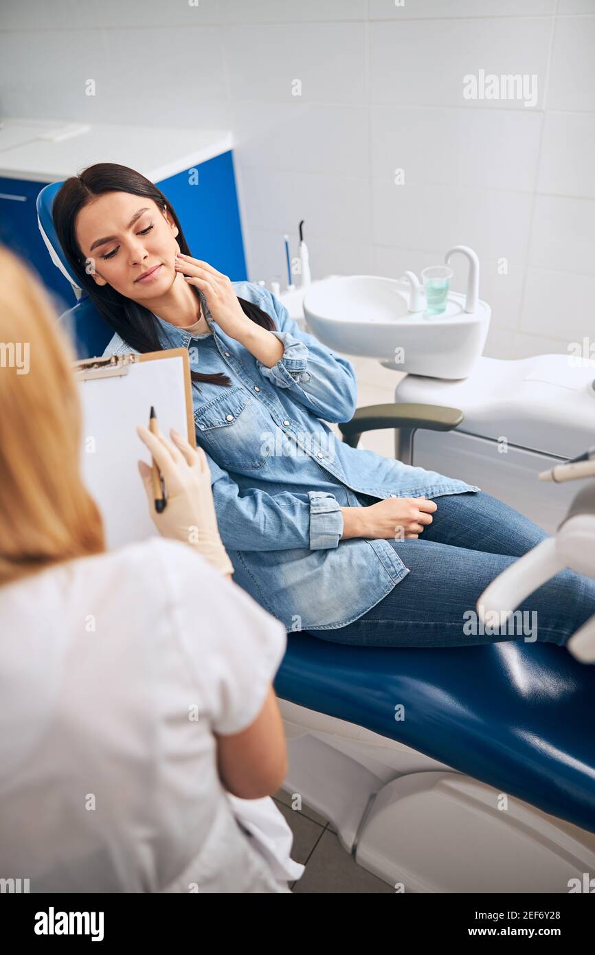 Young worried female person suffering sharp toothache Stock Photo - Alamy