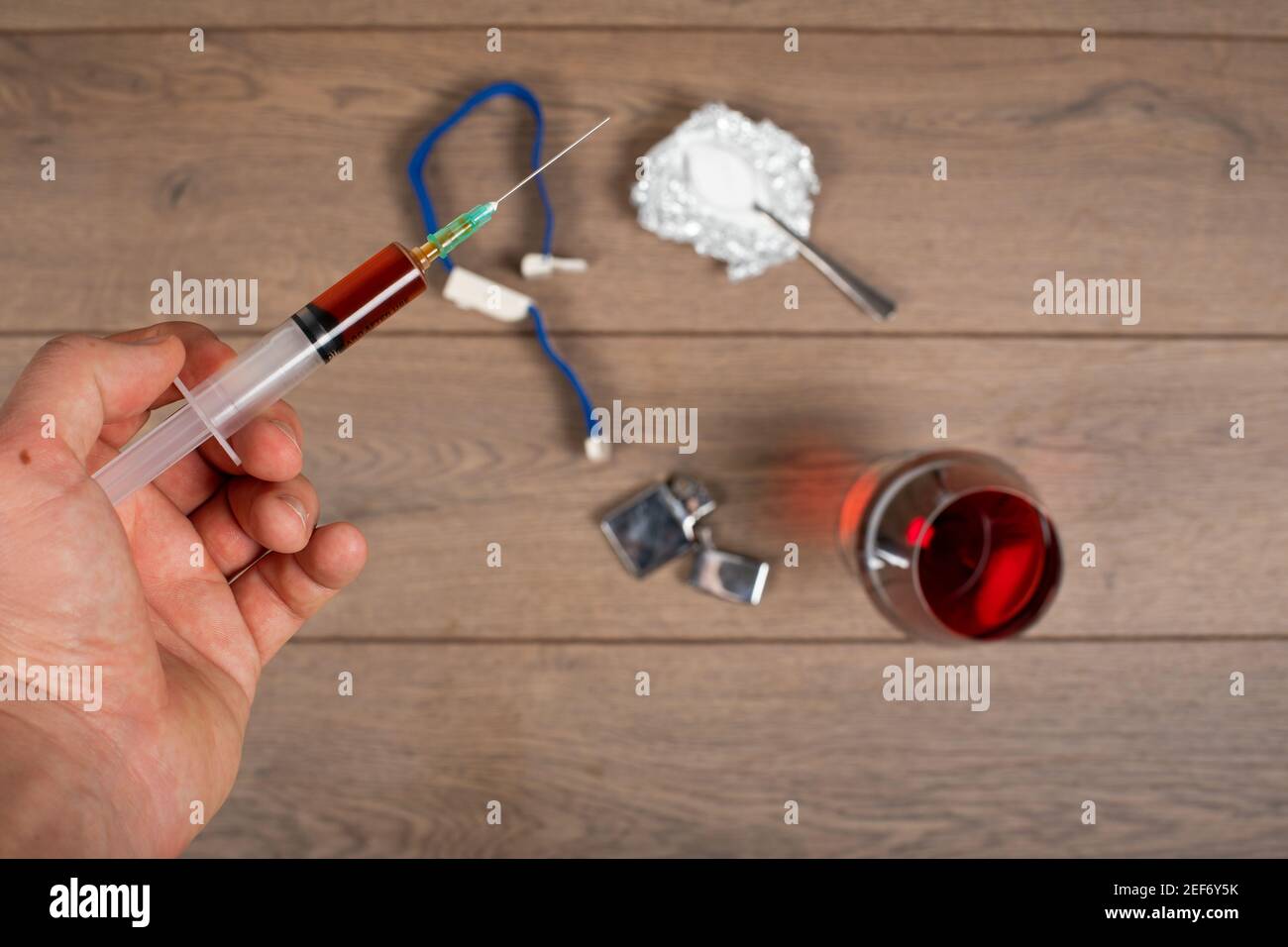 Drug syringes, heroin, spoon on a wooden floor Stock Photo - Alamy