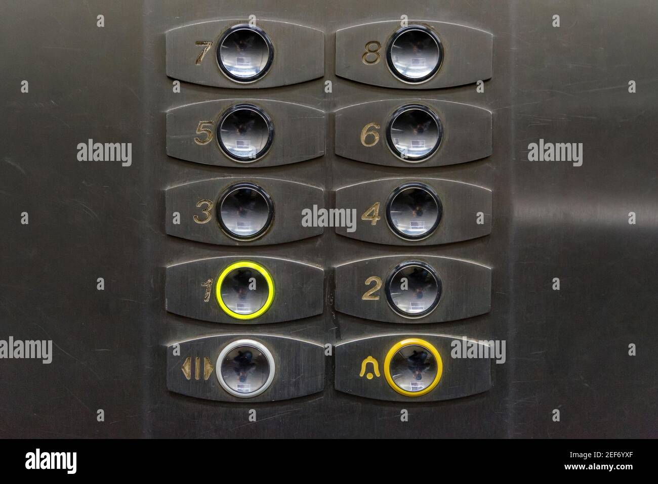 Stained elevator lift with worn, scratched and dirty stained buttons ...