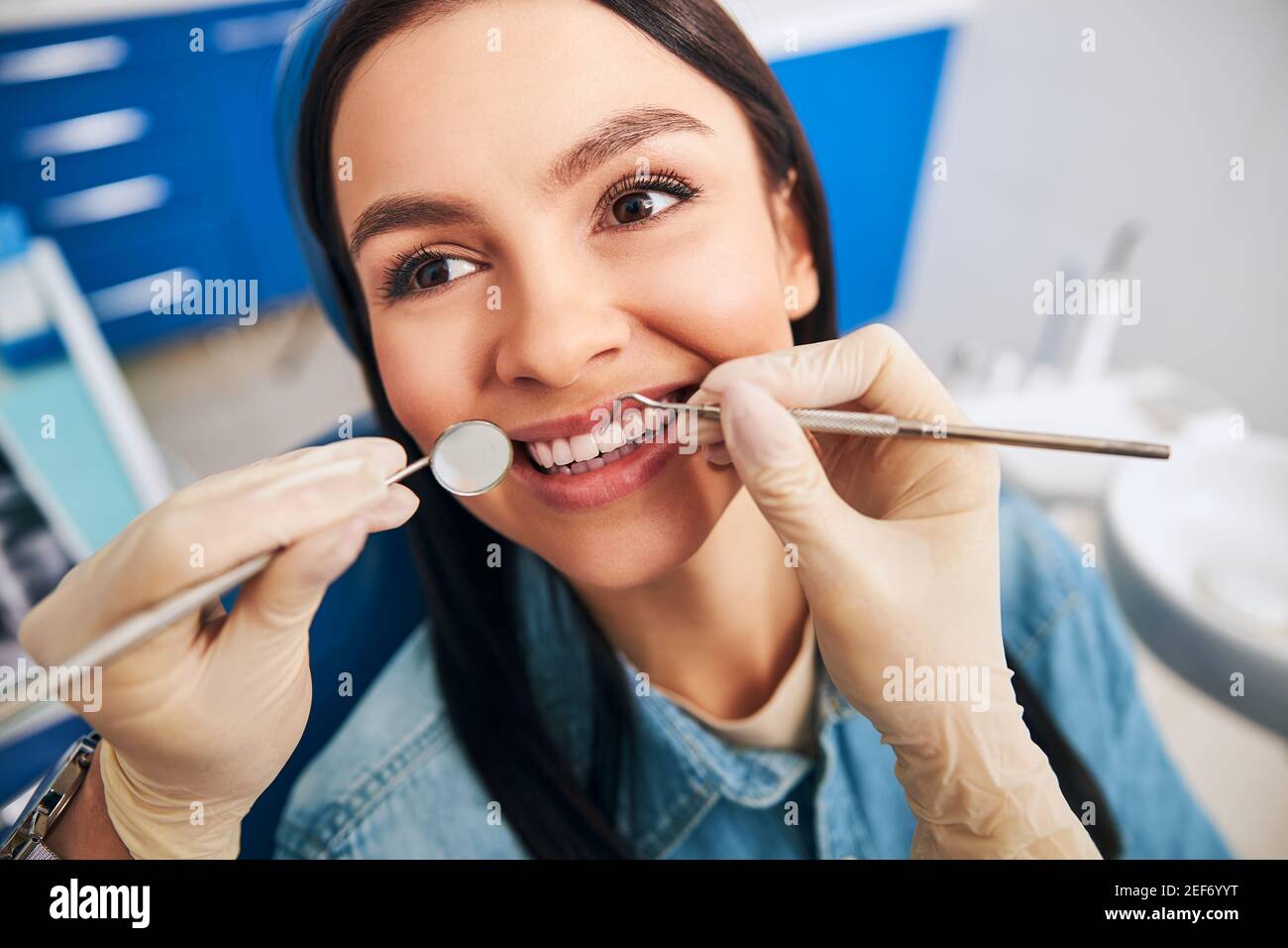 Portrait of cute female that showing her teeth Stock Photo - Alamy