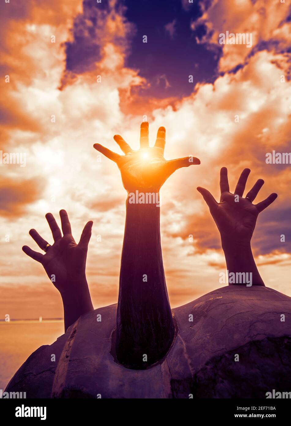 Hands asking help against cloudscape Stock Photo - Alamy