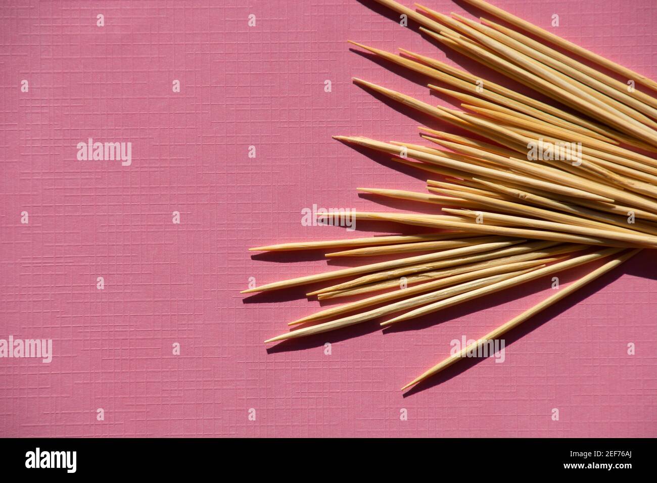 toothpicks made of bamboo on pink background with clipping path and ...