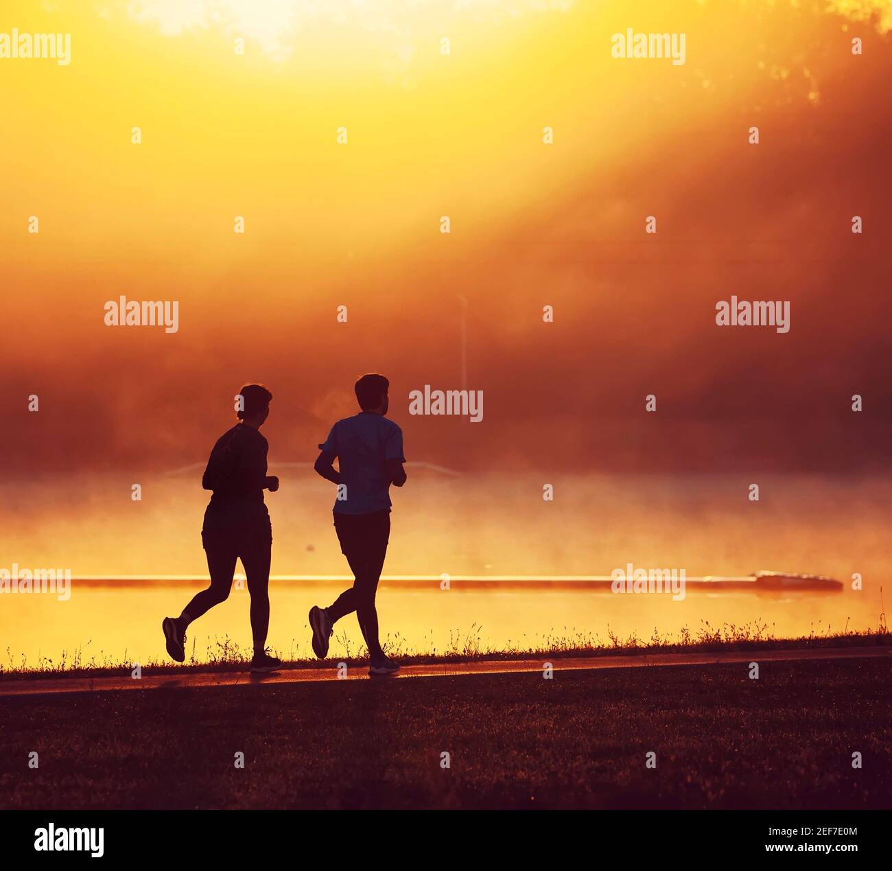 Silhouette of running man at sunrise Stock Photo - Alamy
