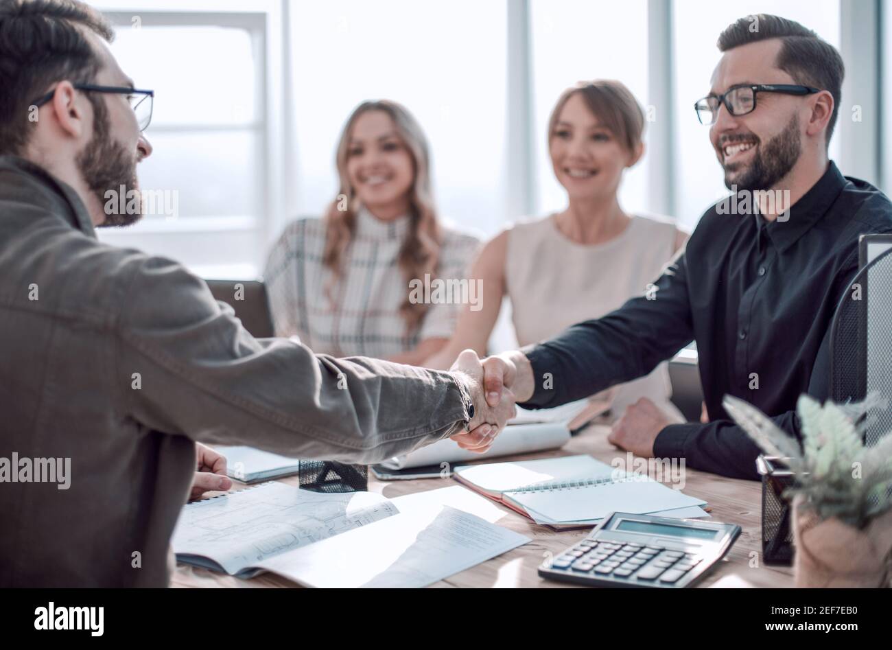 large group of employees in the workplace in the office Stock Photo - Alamy