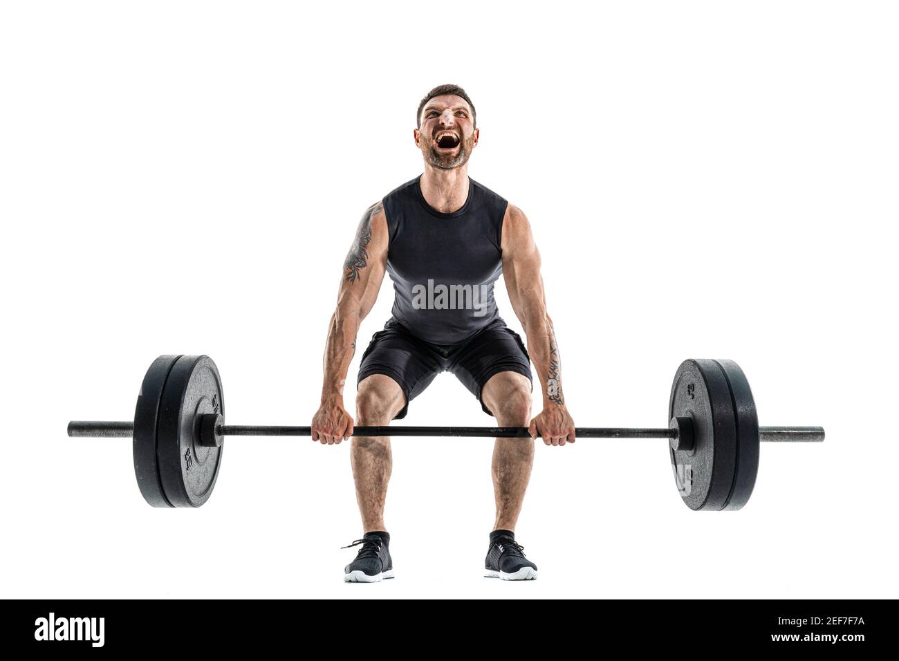 Fit Man Doing A Deadlift Exercise. Full length studio shot isolated on ...