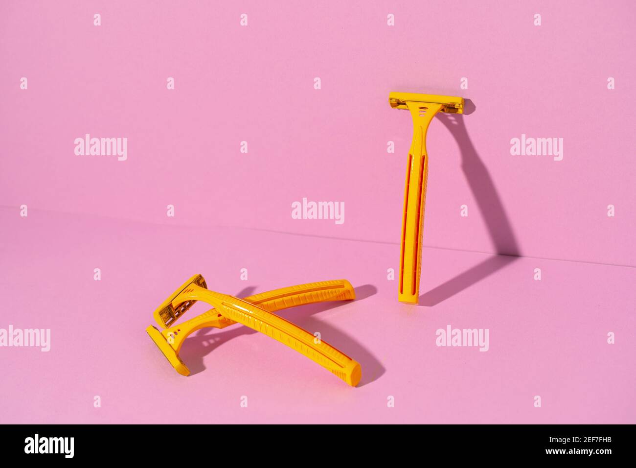 Yellow disposable razors on pink background, studio shot Stock Photo ...