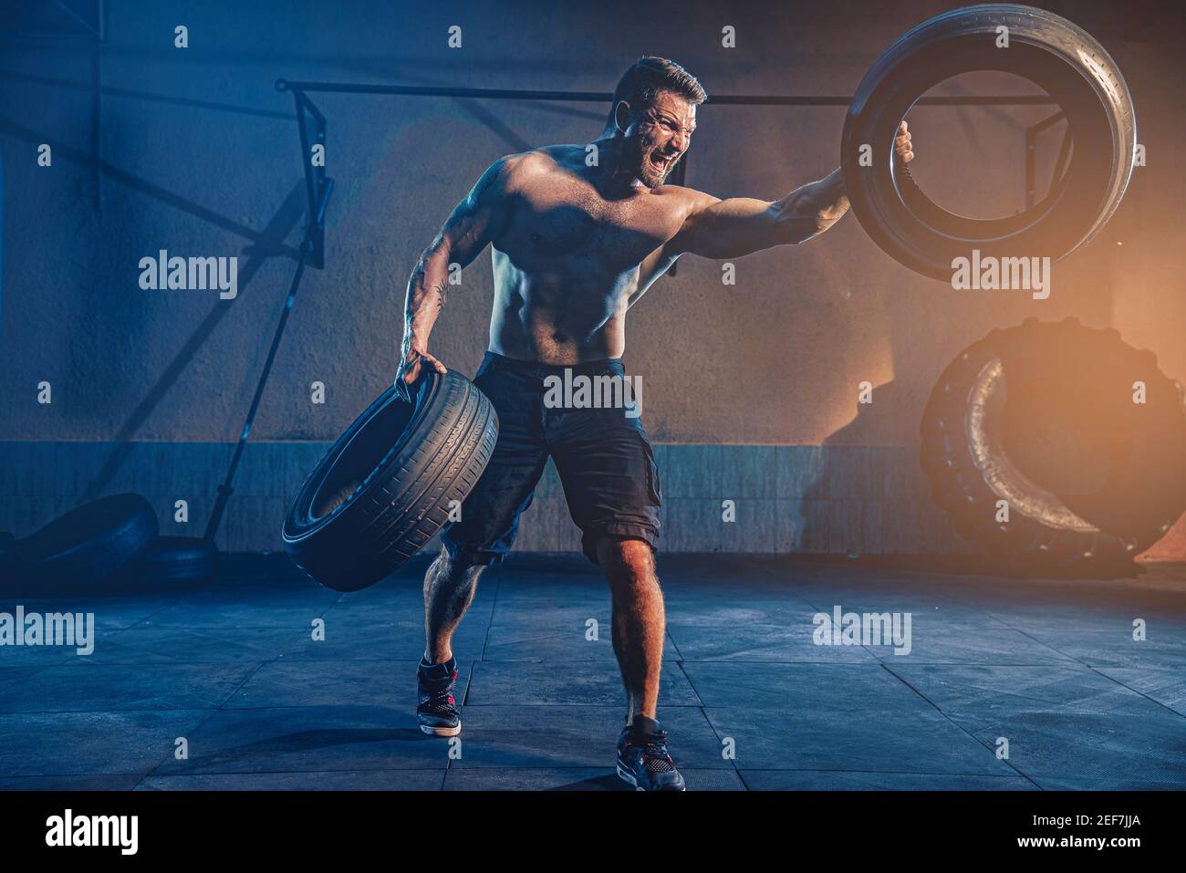 Bodybuilding training, bearded strong sportsman with muscular body ...