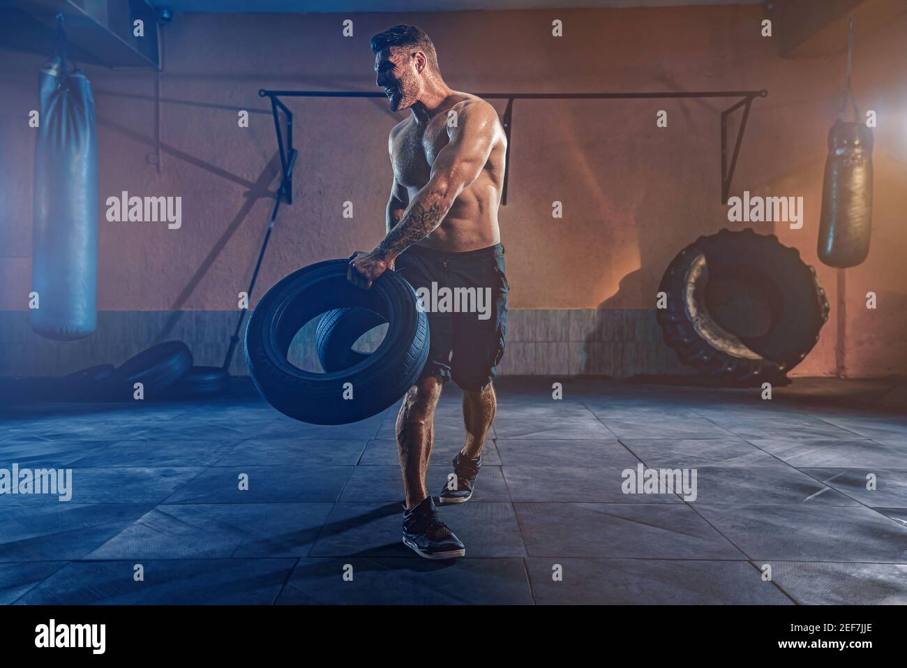 Bodybuilding training, bearded strong sportsman with muscular body ...