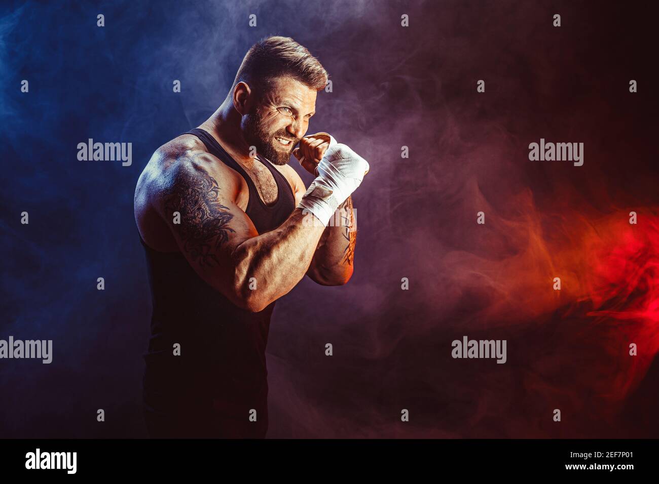 Sportsman boxer fighting on black background with shadow. Copy Space ...