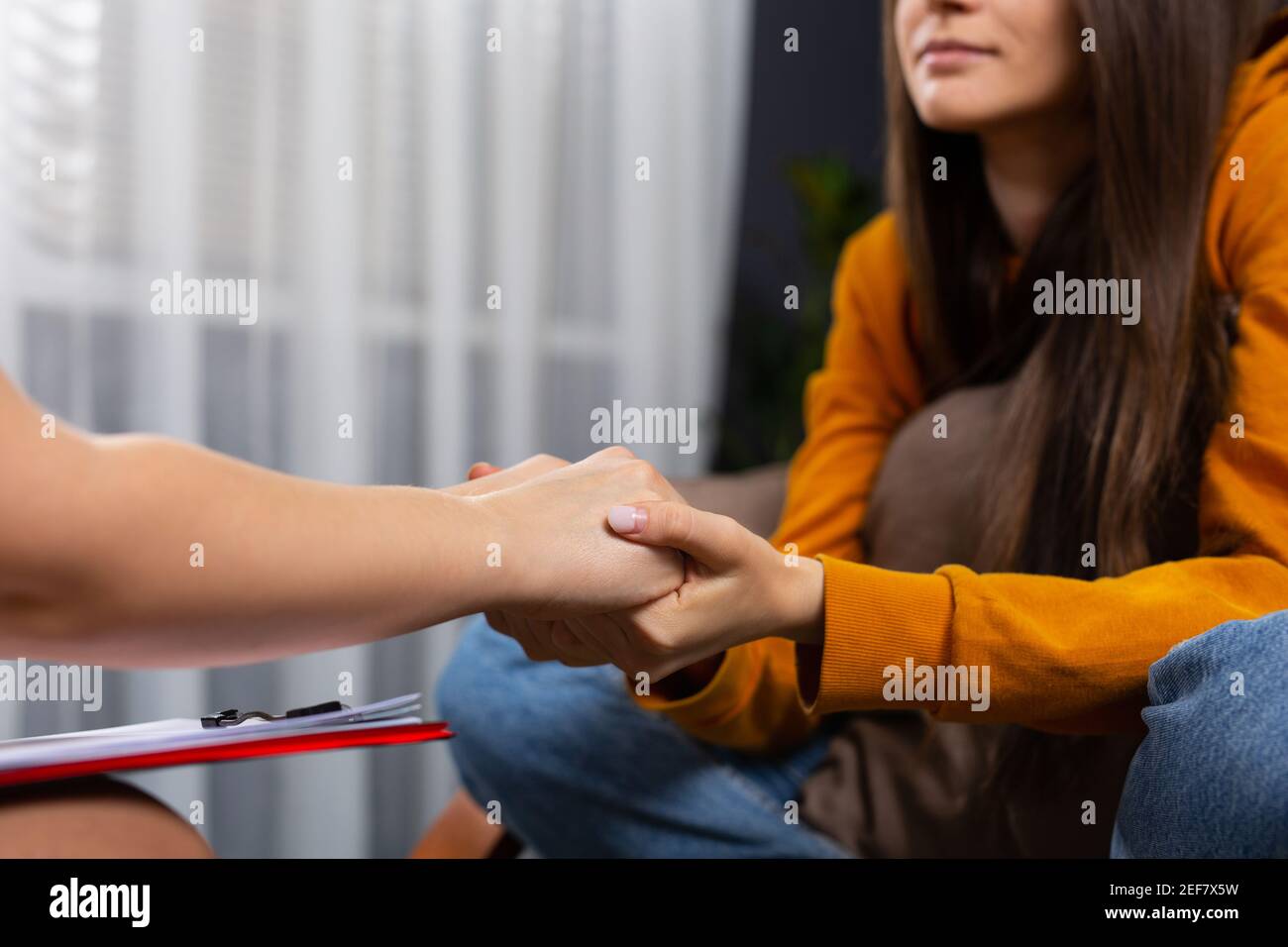 Care, trust, professionalism concept. Close up of therapist holding ...
