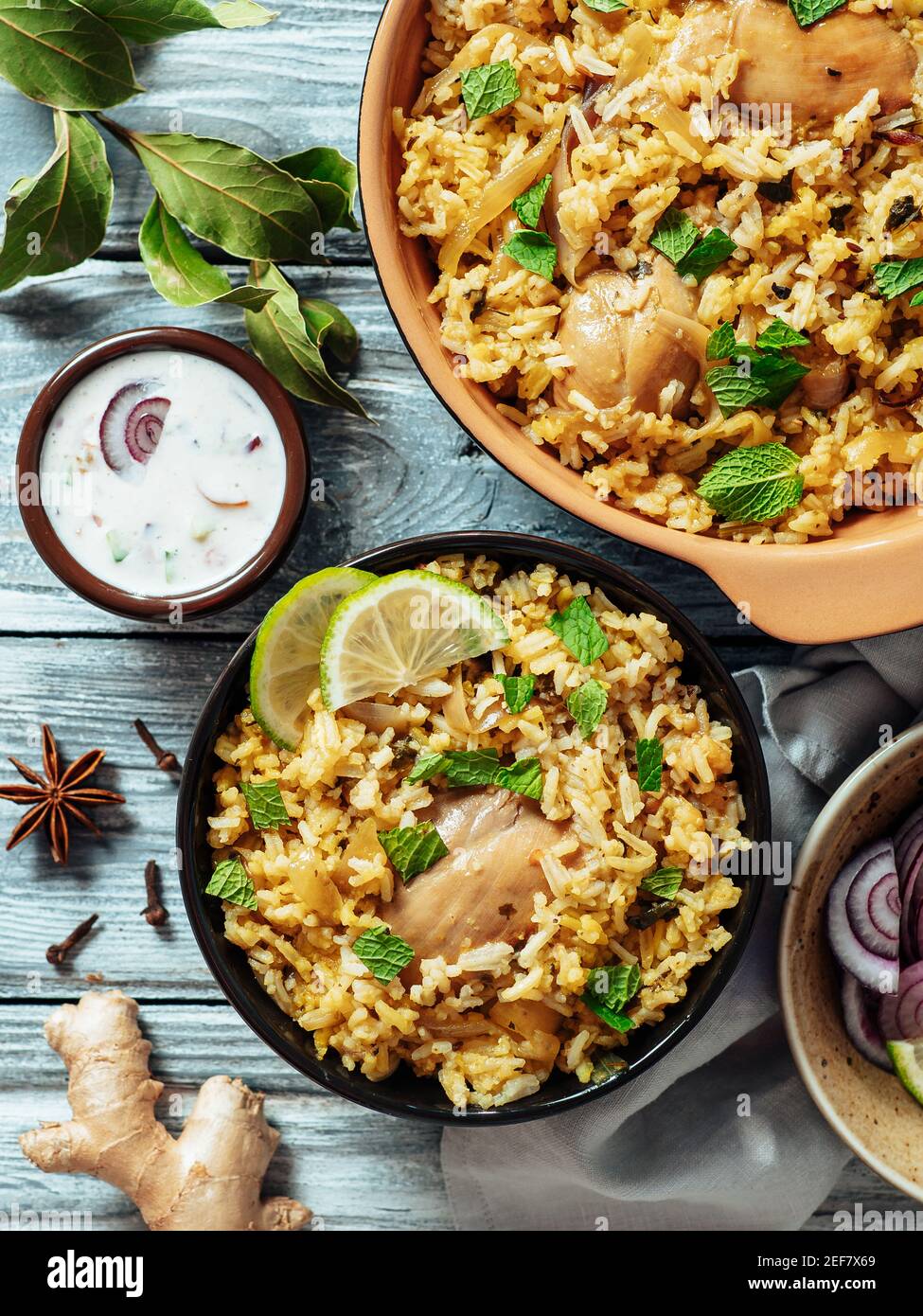 Pakistani food - biryani rice with chicken and raita yoghurt dip ...