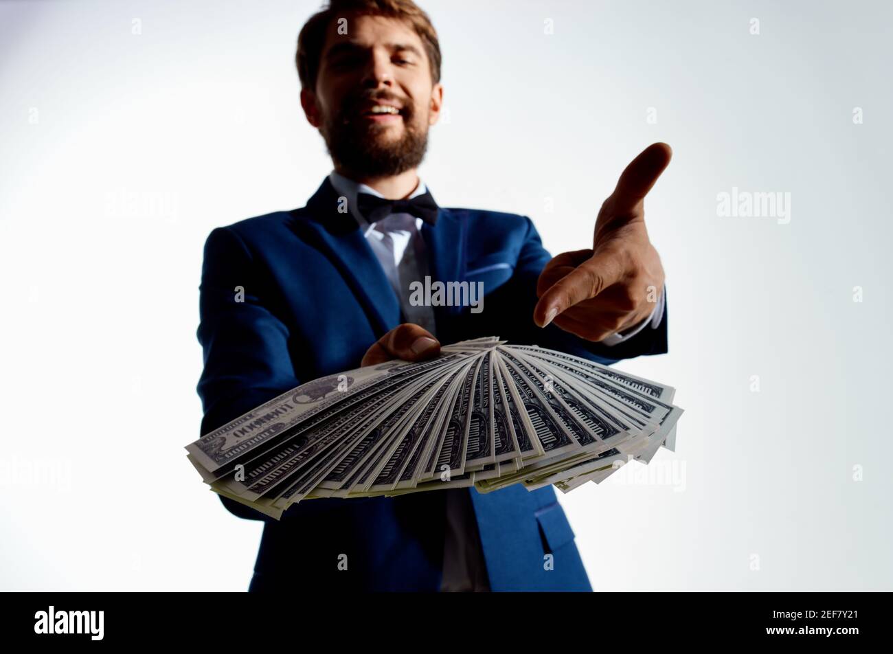 rich guy with a stack of bills money classic suit gesturing with his ...