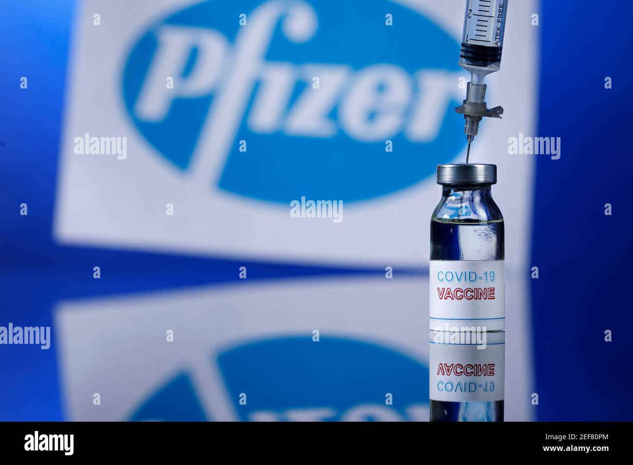 Coronavirus vaccine bottle and in the background the brand of the ...