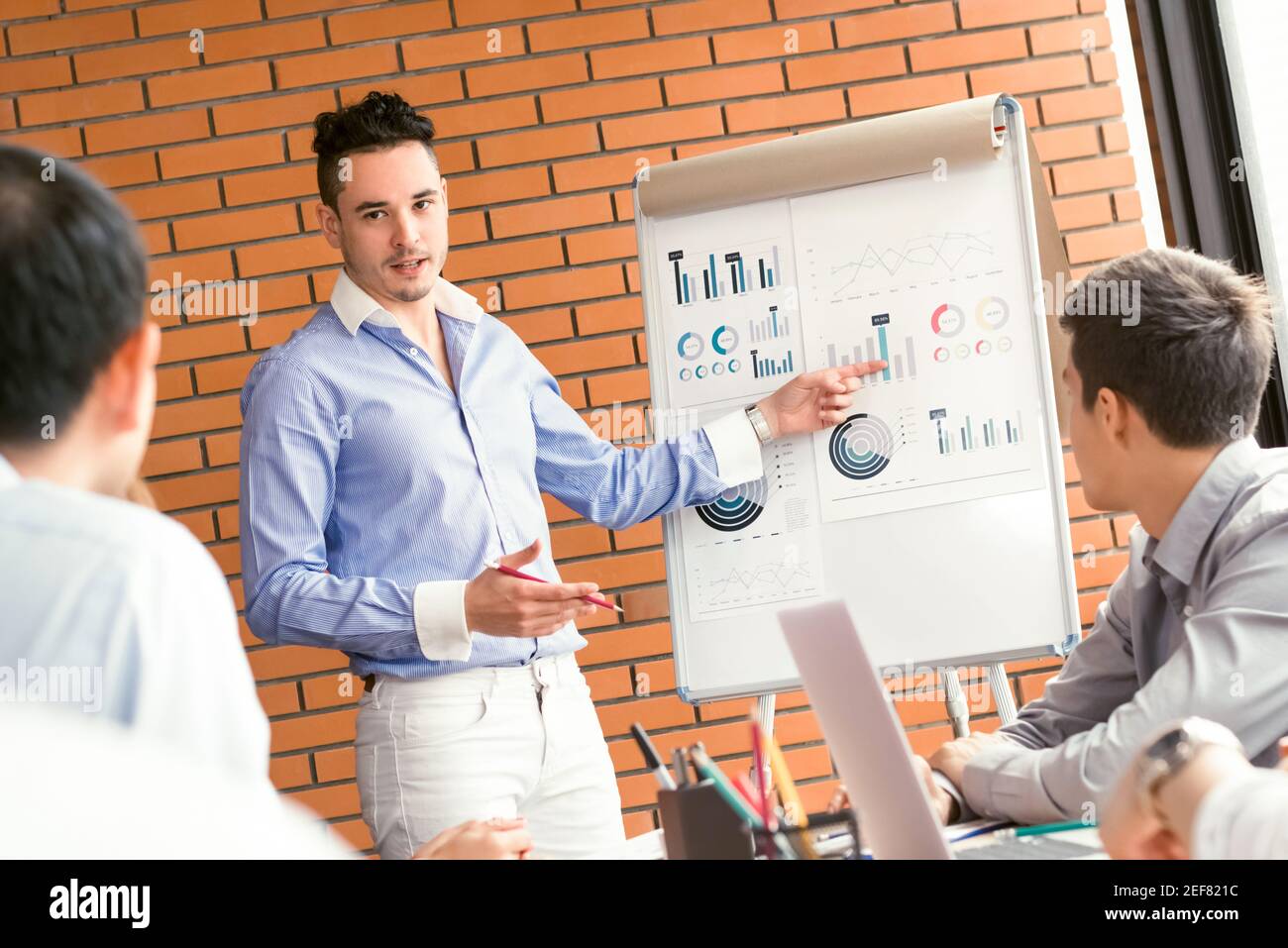 Group of people at a presentation hi-res stock photography and images ...