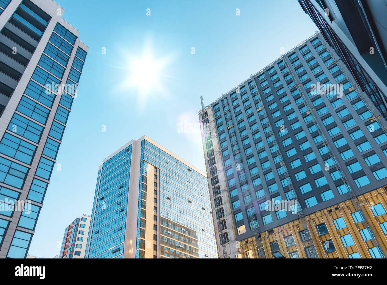 Several multi storey buildings with a glass facade and under ...