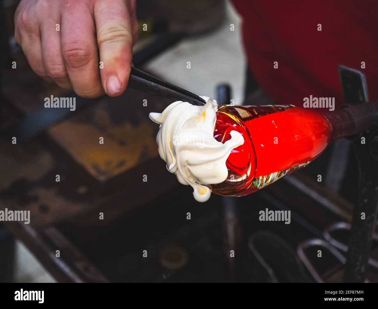 Glass-blower artist create white glass layer on transparent glass bowl ...