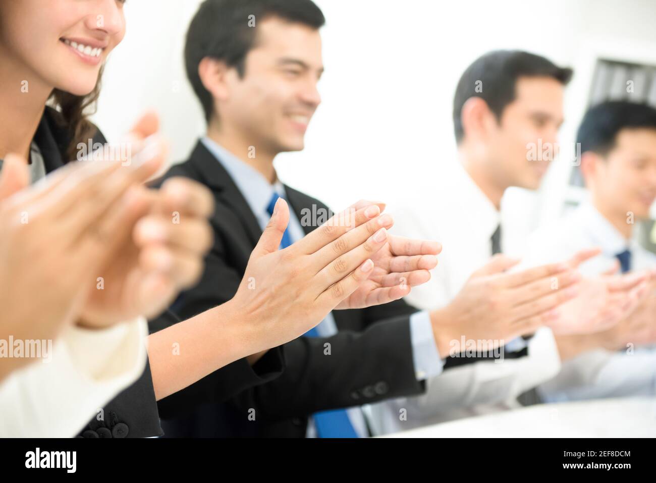 Group of business people clapping their hands at the meeting Stock ...