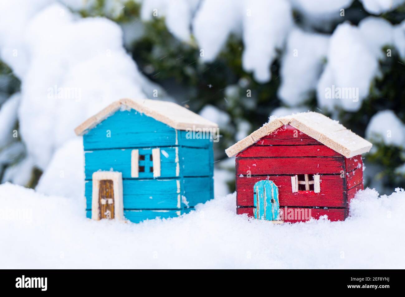 colored wooden model house in snow Stock Photo - Alamy