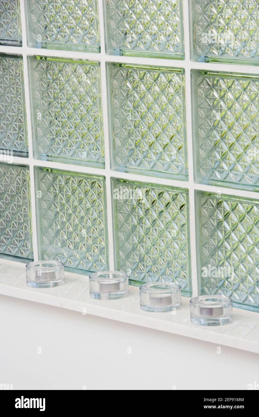 Candlestick holders in a row Stock Photo - Alamy