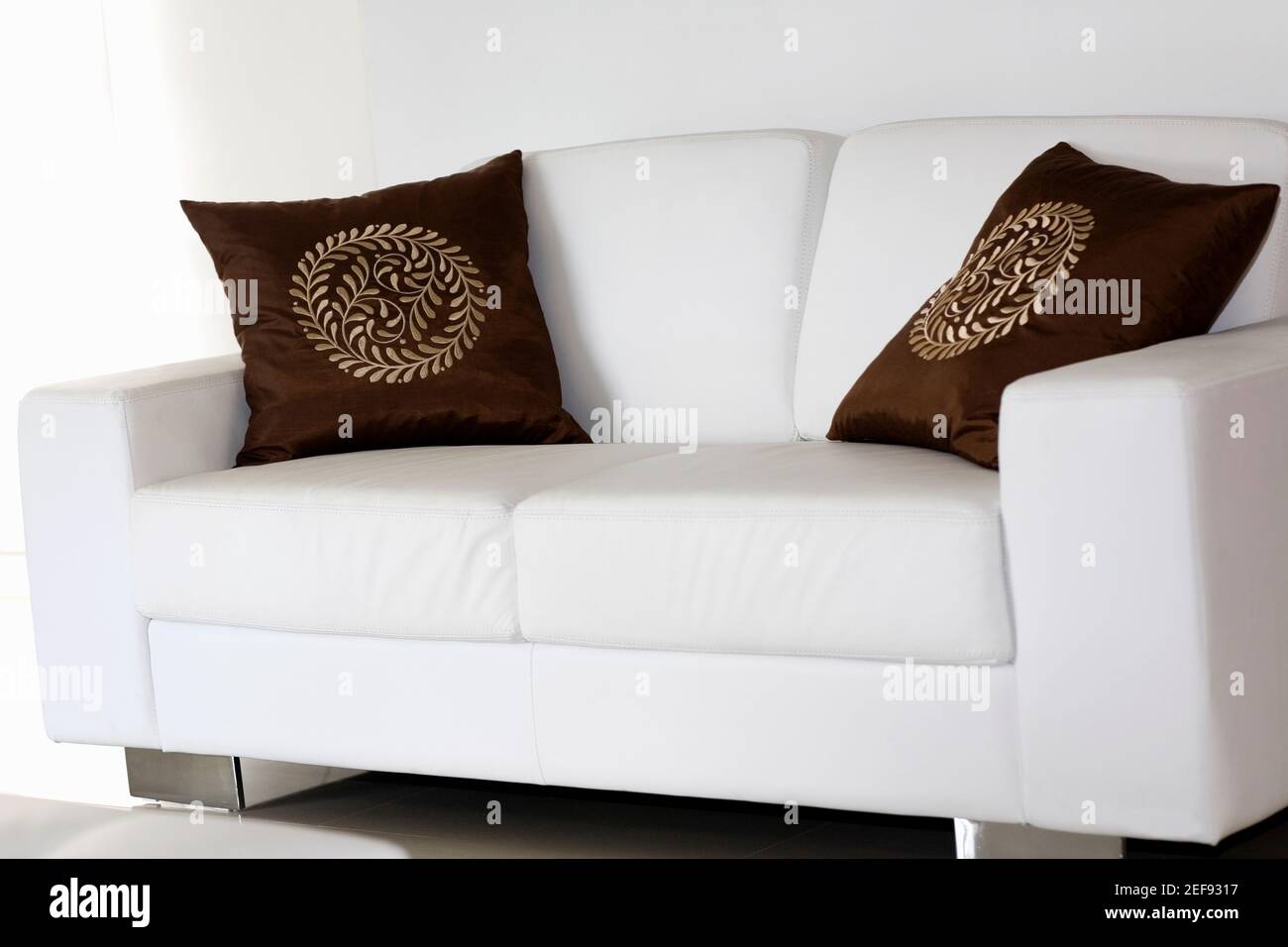 Two cushions on a couch Stock Photo - Alamy