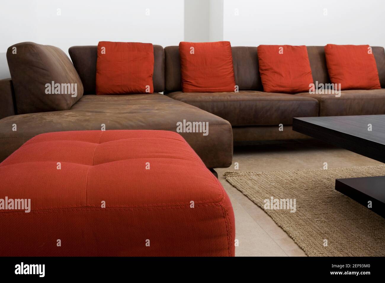 Couch and ottomans in a living room Stock Photo - Alamy