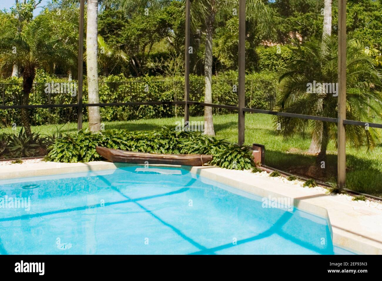 Swimming pool in a garden Stock Photo - Alamy
