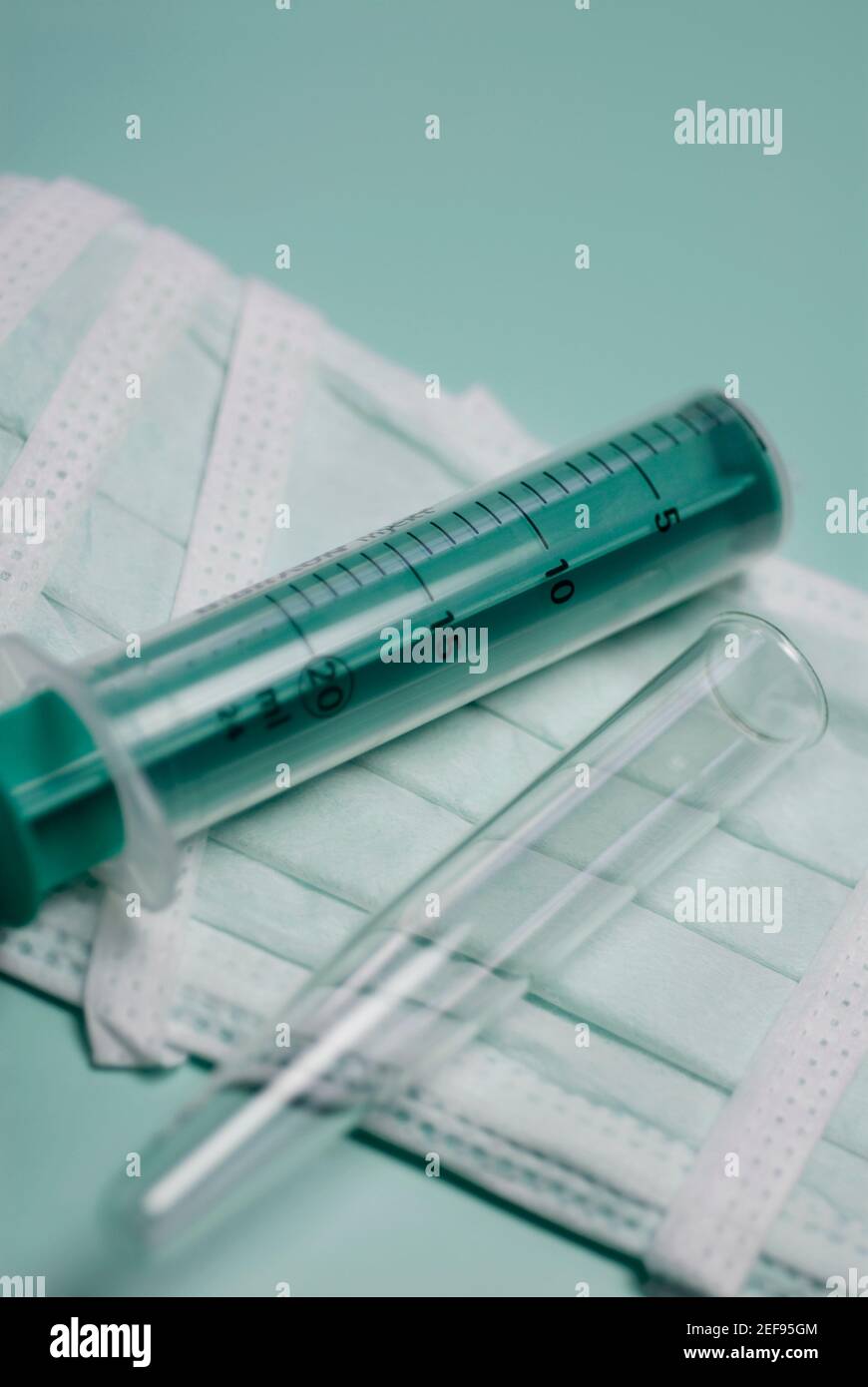 Close up of a syringe and a test tube Stock Photo - Alamy