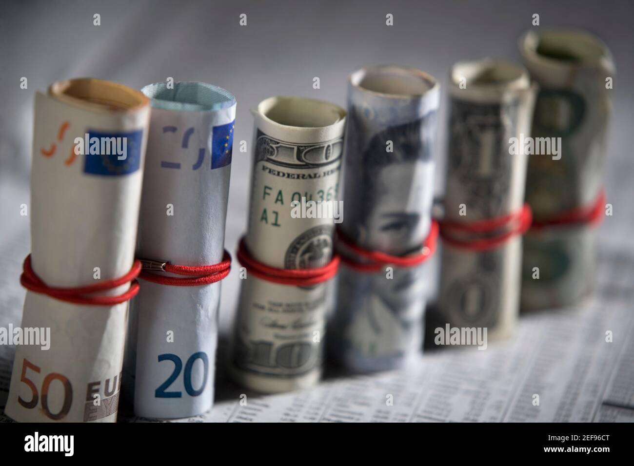 Close-up of paper currency rolls with rubber bands in a row Stock Photo ...