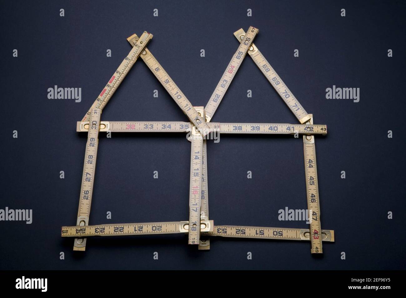 Close-up of a measuring scale in the shape of houses Stock Photo - Alamy