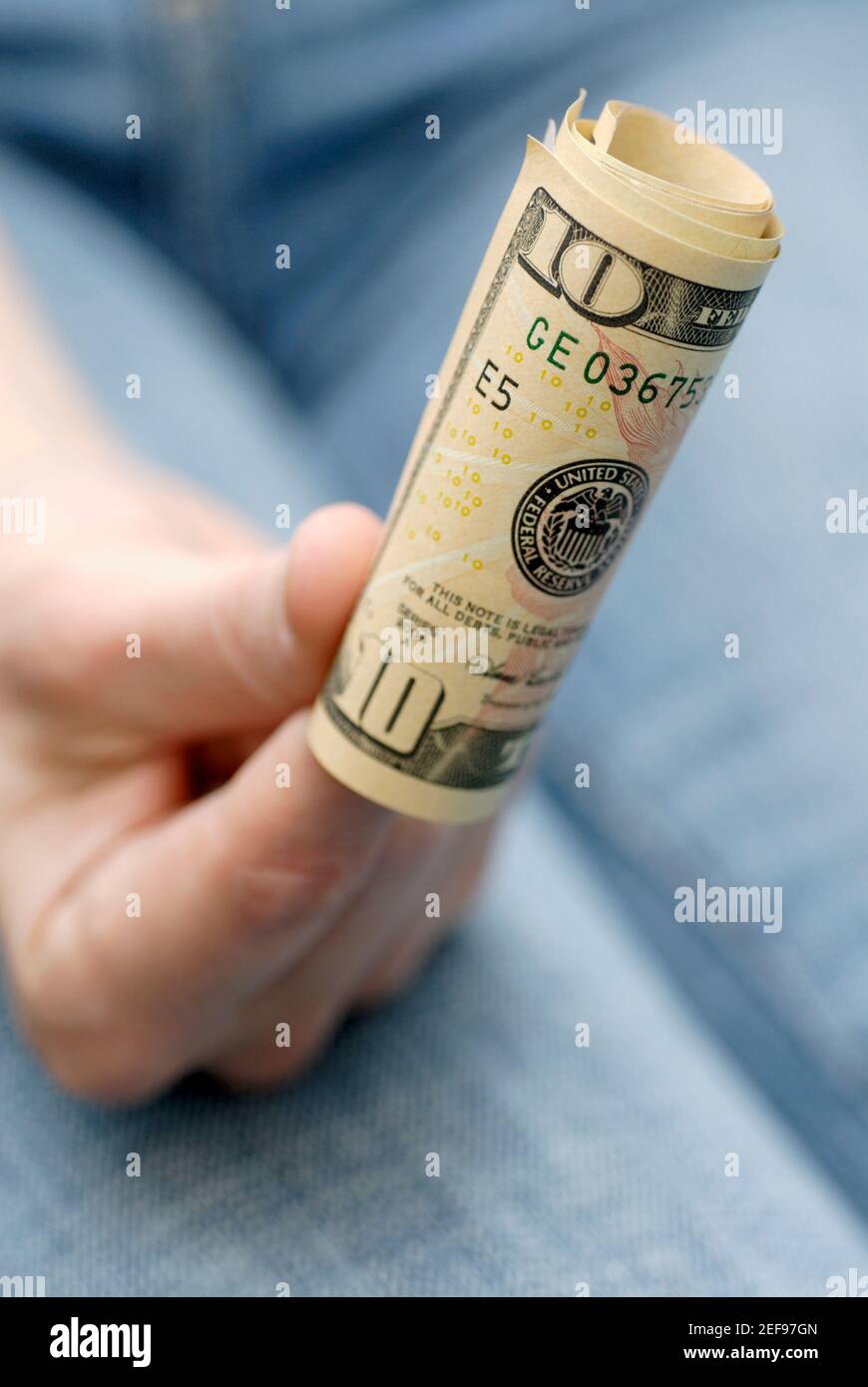 Hand holding 10 dollar banknote hi-res stock photography and images - Alamy