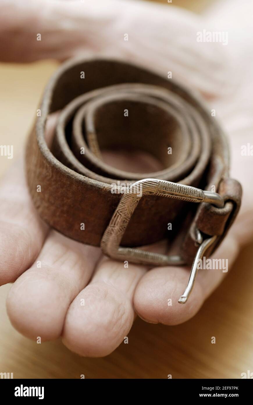Belt in hand hi-res stock photography and images - Alamy