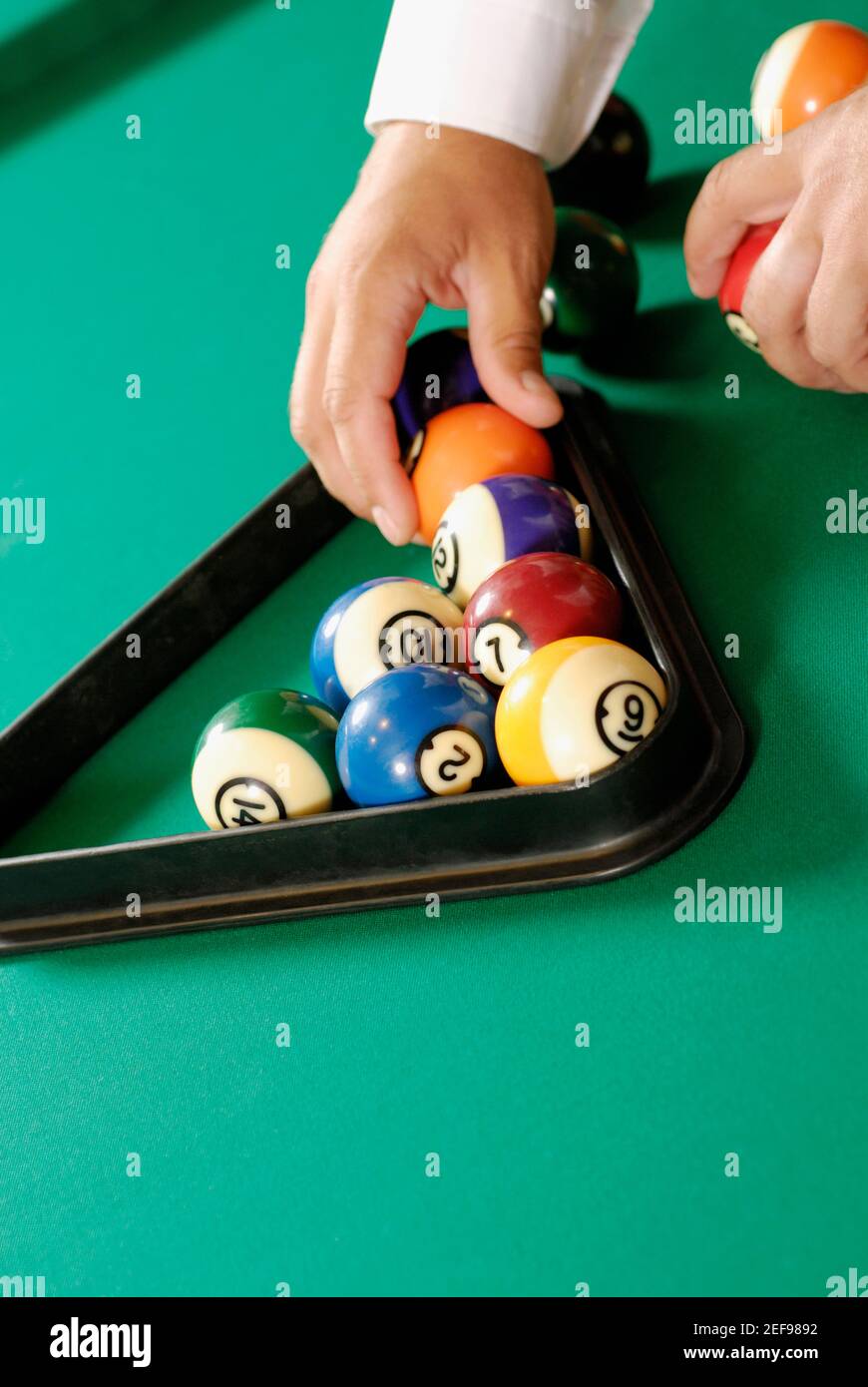 Hand holding two balls hi-res stock photography and images - Alamy