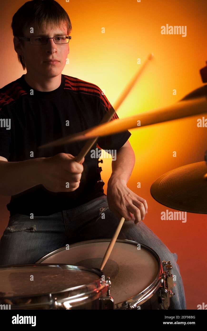 Male drummer playing drums Stock Photo - Alamy