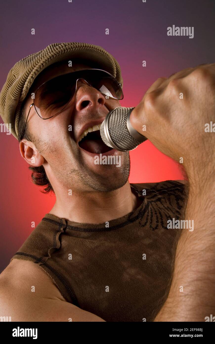 Hand holding microphone mouth singing hi-res stock photography and ...
