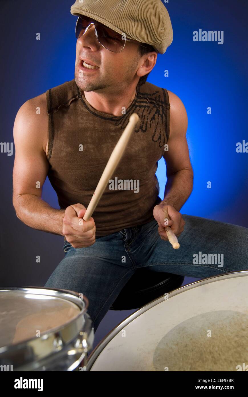 Male drummer playing drums Stock Photo - Alamy