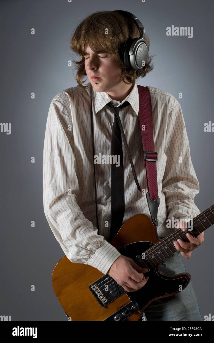 Vertical shot young male guitarist hi-res stock photography and images ...