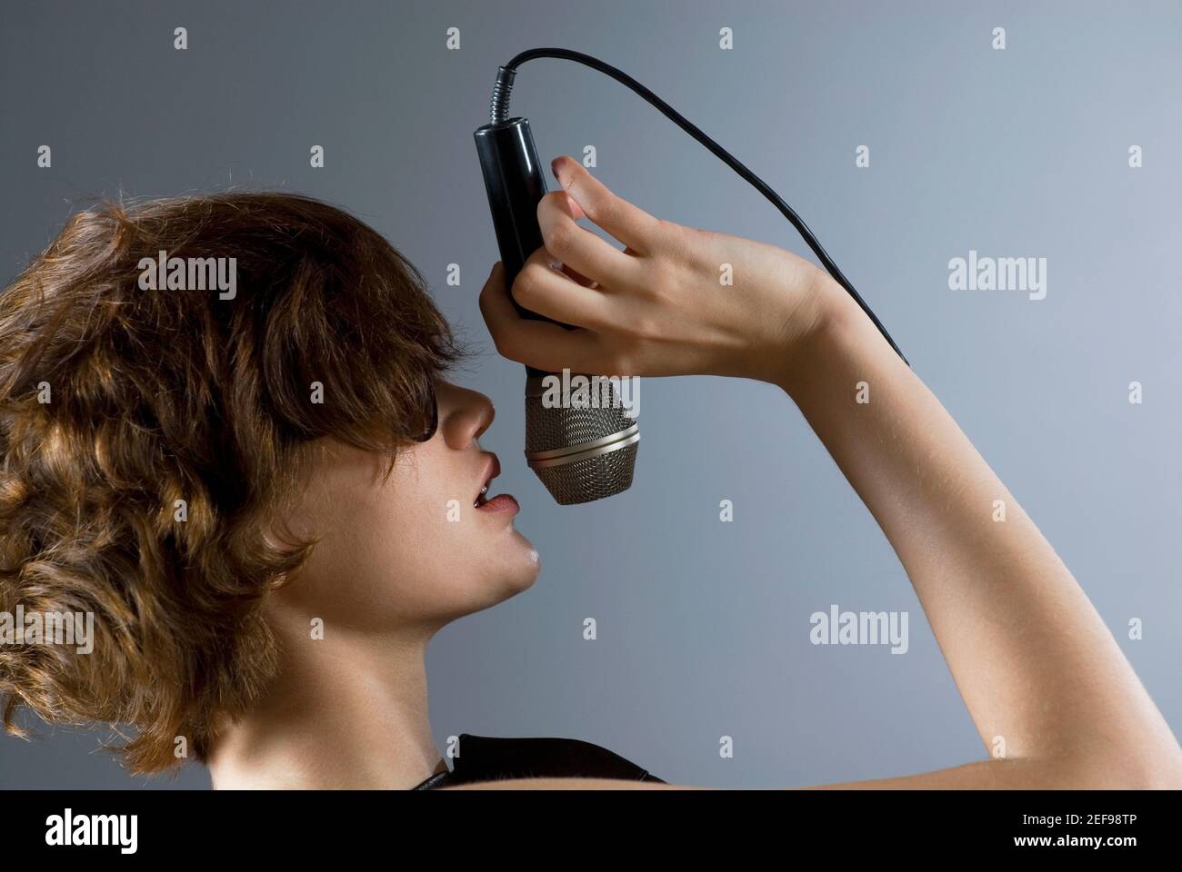 Art culture and entertainment holding microphone musical instrument ...