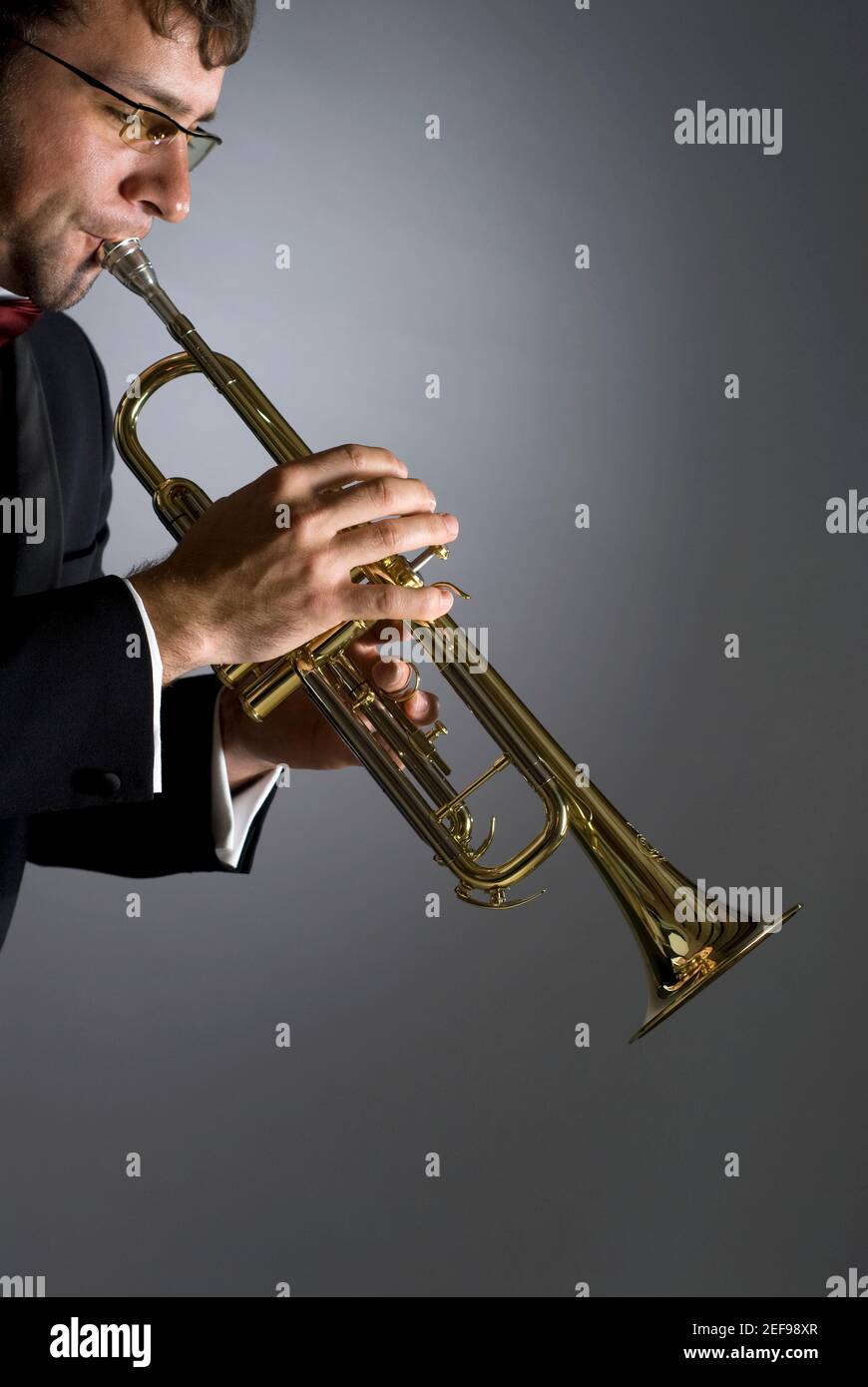 Side profile of a musician playing a trumpet Stock Photo - Alamy