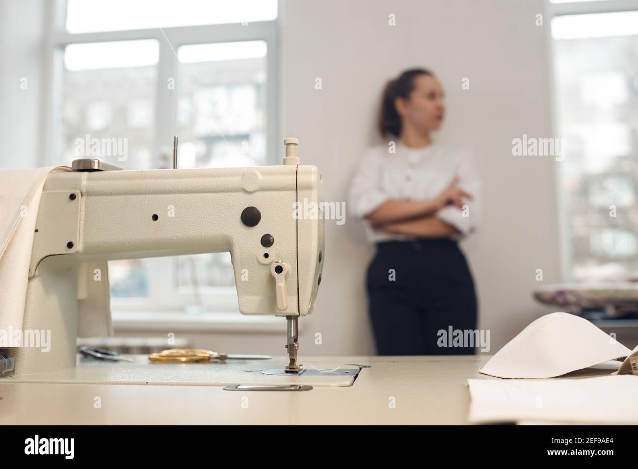 young girl seamstress posing in front of her tailoring workshop Stock ...