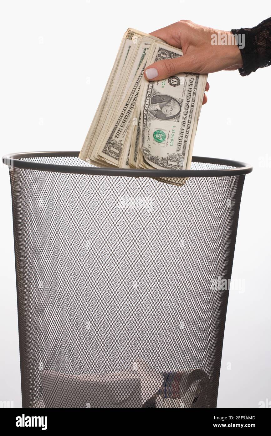 Throwing money down the drain hi-res stock photography and images - Alamy